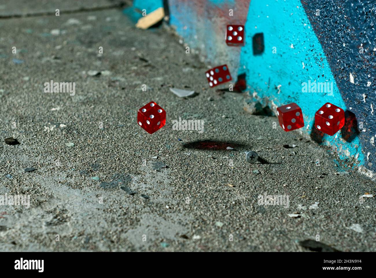 tumbling dice on a curb Stock Photo - Alamy