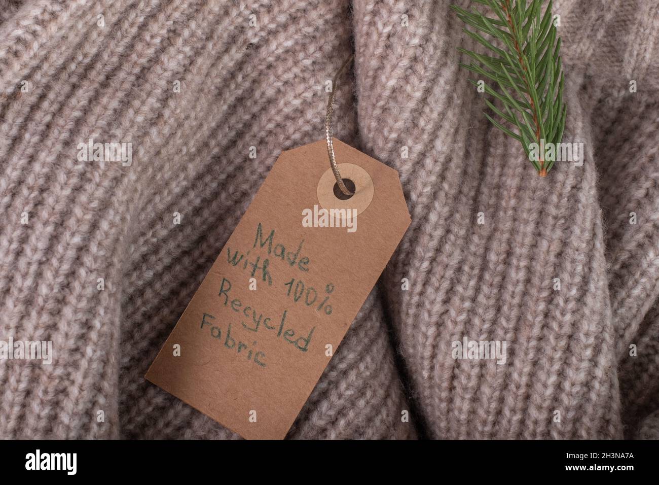 Label made with recycled fabric and decorated with a Christmas tree ...