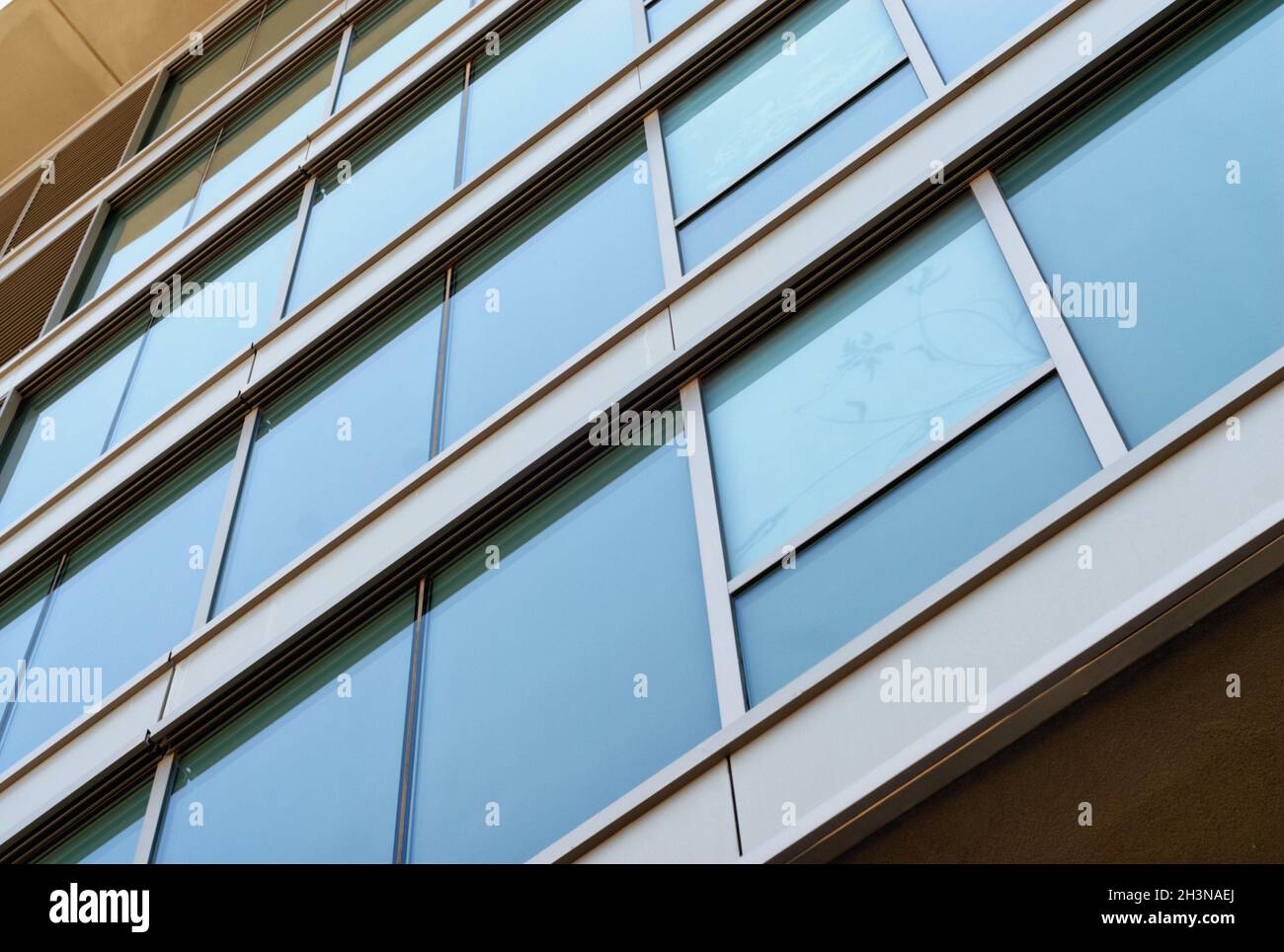 Simple curtain wall of a high rise Stock Photo - Alamy