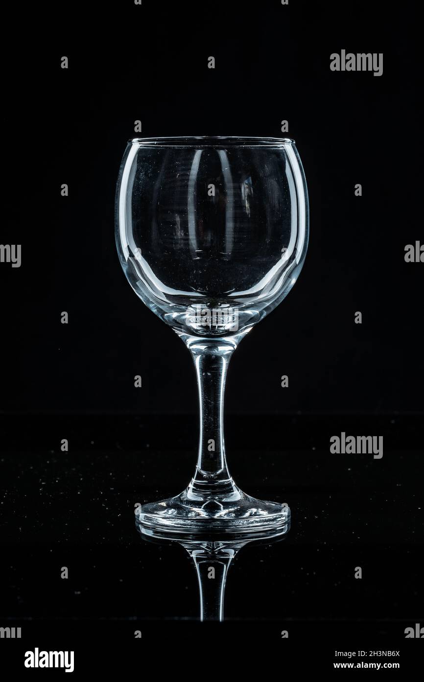 Wine glass on black background, front view Stock Photo - Alamy