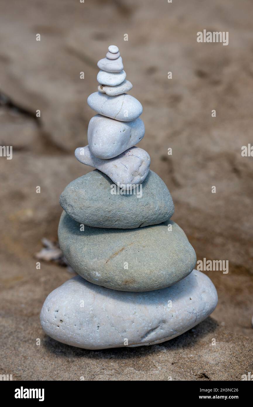 pebbles balanced in a tower formation on a beach in greece, pebbles or ...