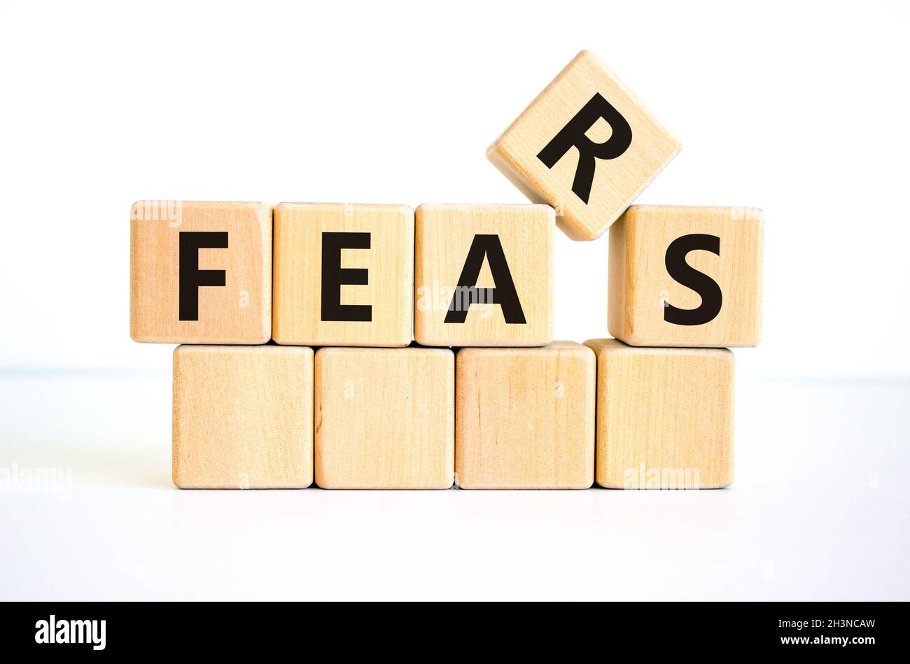 Fears symbol. The concept word 'fears' on wooden cubes. Beautiful white ...