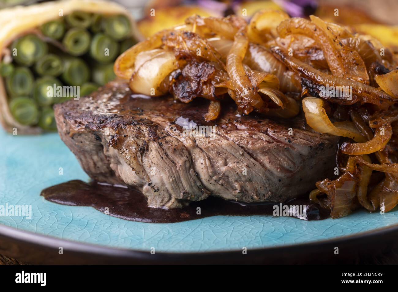 Swabian roast beef with onions, potatoes and beans Stock Photo - Alamy
