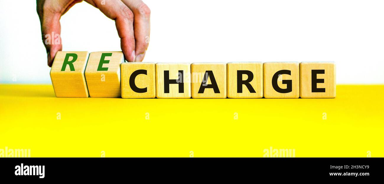 Charge or recharge symbol. Businessman turns wooden cubes and changes ...