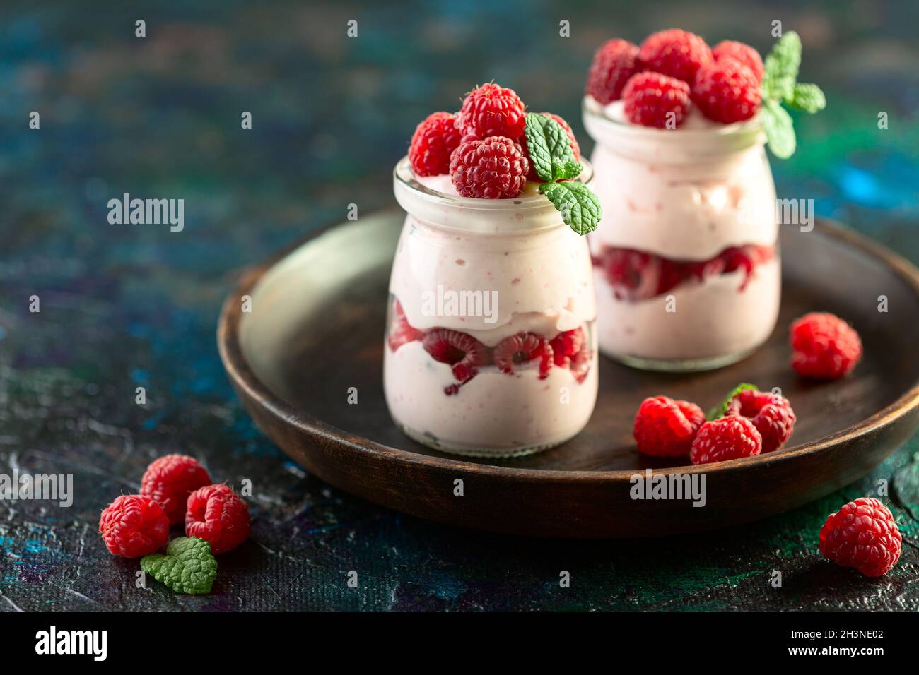 Yogurt and raspberries hi-res stock photography and images - Alamy