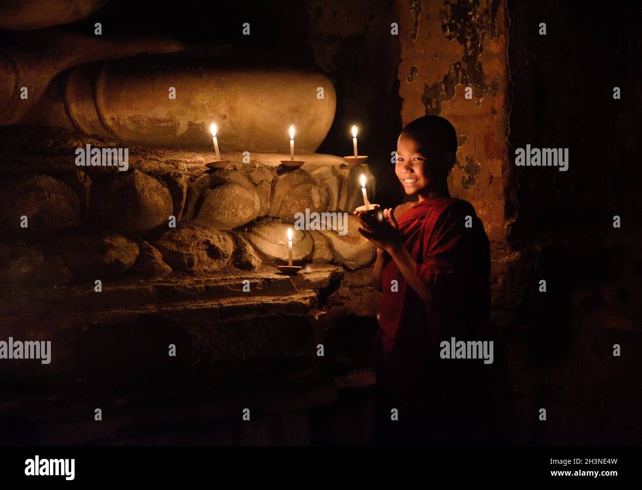 Novice Monk Praying With Candles High Resolution Stock Photography and ...