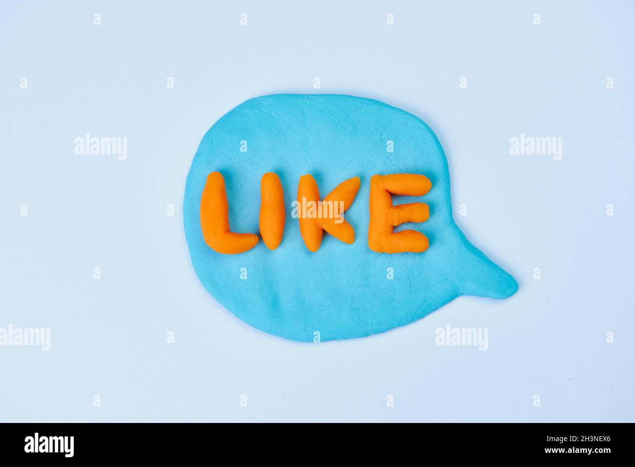 the word like in the middle of a blue speech bubble made out of ...