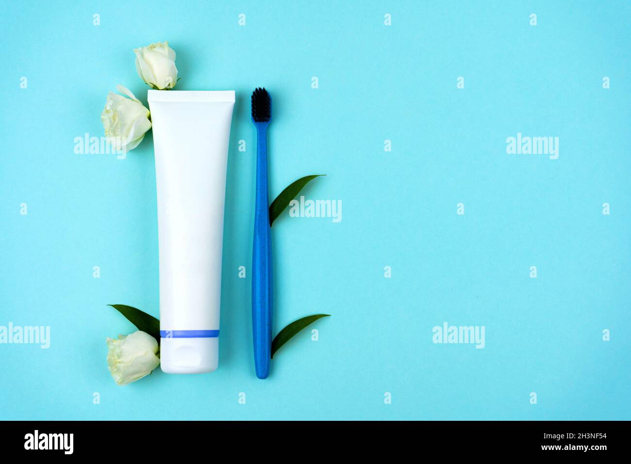 Recycled plastic toothpaste tube with toothbrush with white flowers and ...