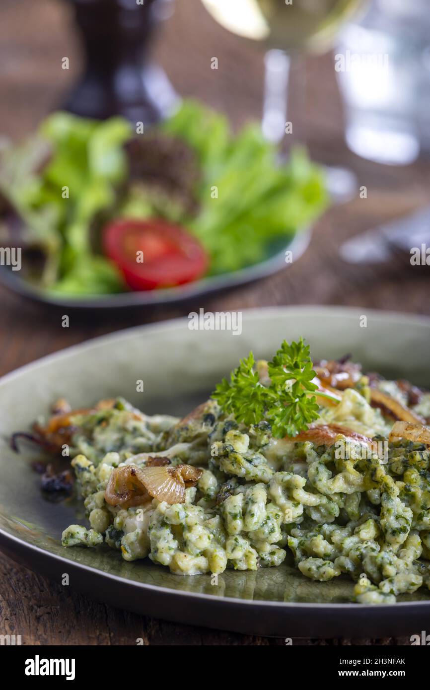 Spinach spaetzle on wood Stock Photo - Alamy