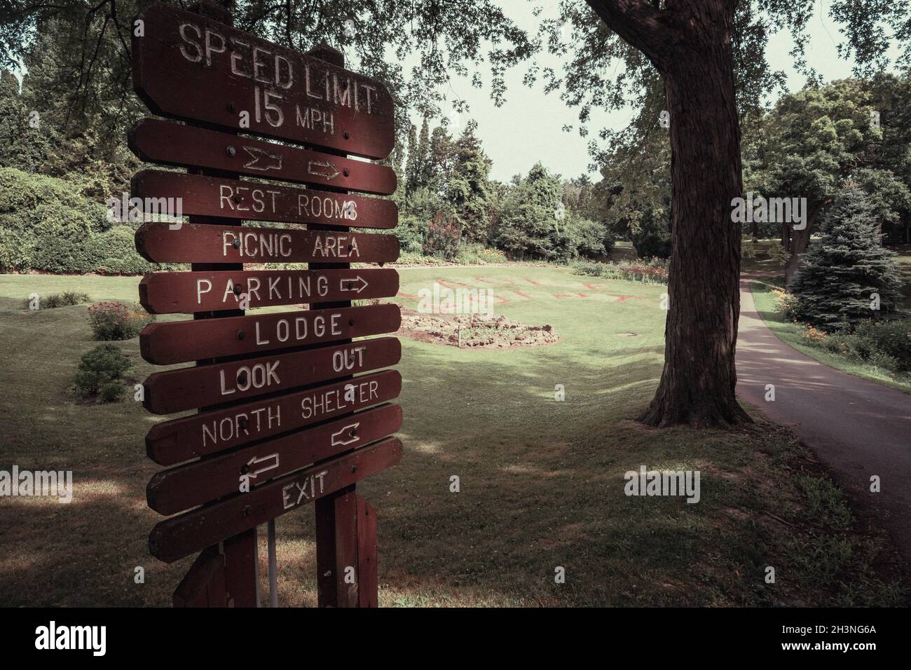 Closeup shot of a sign board showing direction in the national park ...