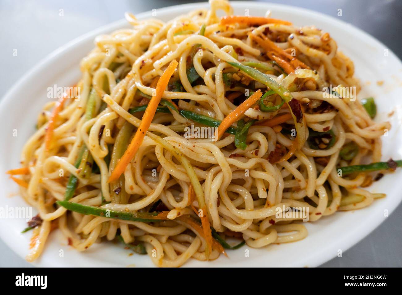 Red spicy cold noodles Stock Photo - Alamy