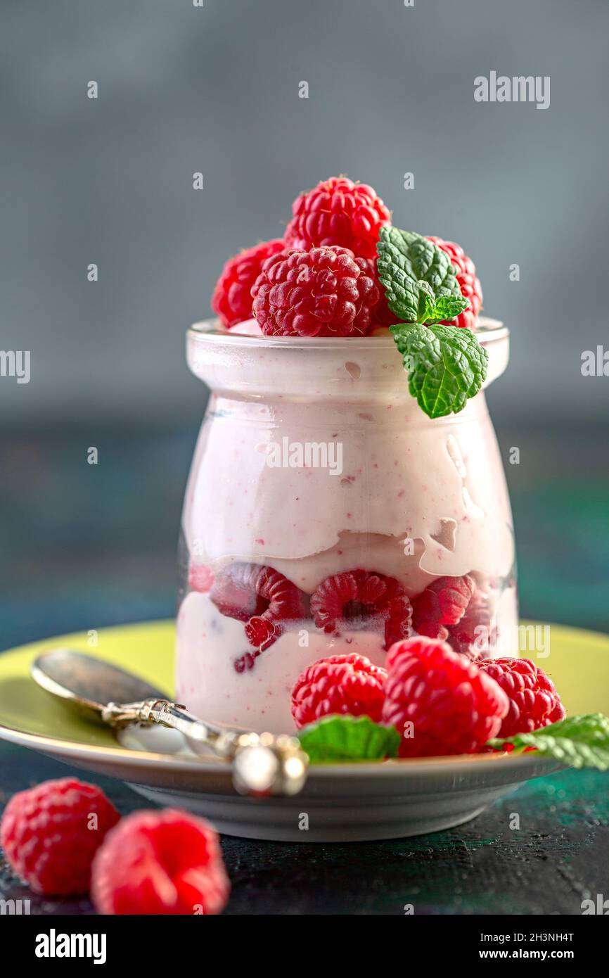 Healthy berry yogurt with fresh raspberries Stock Photo - Alamy
