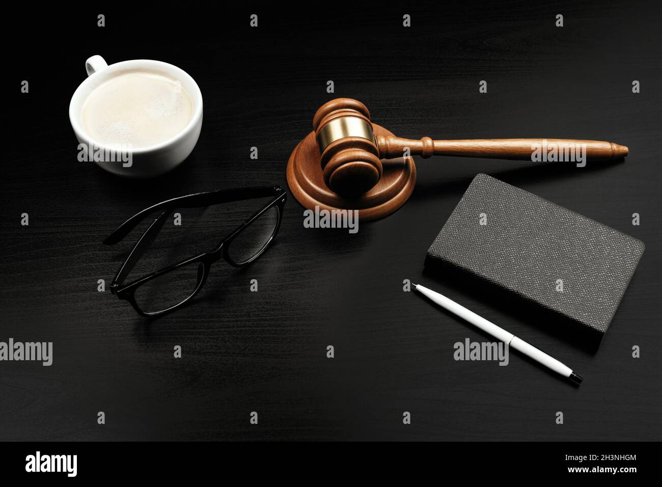 Image of wooden judge hammer on notepad Stock Photo - Alamy