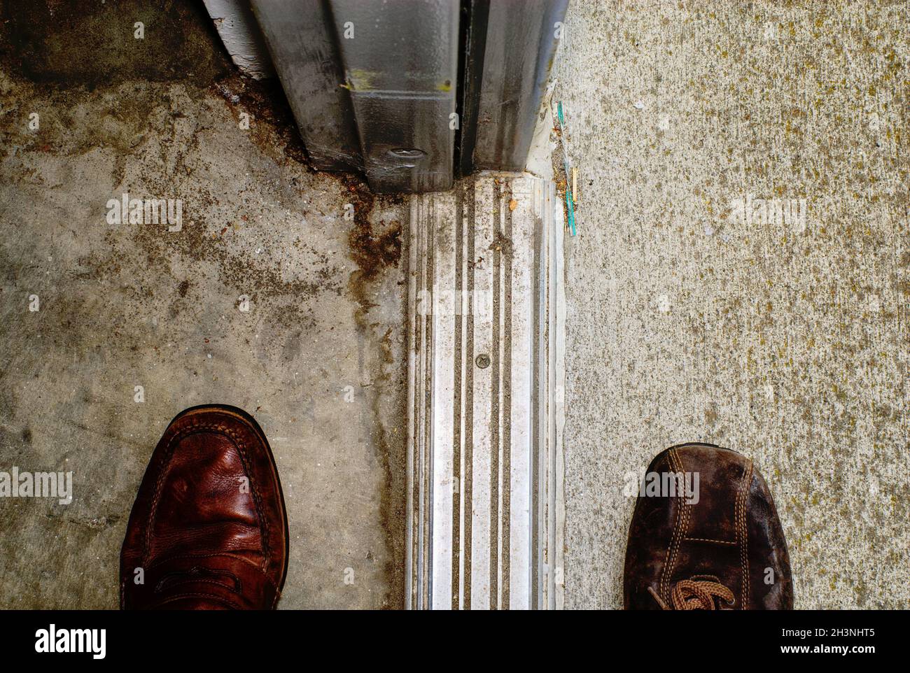 One foot in, one foot out Stock Photo - Alamy