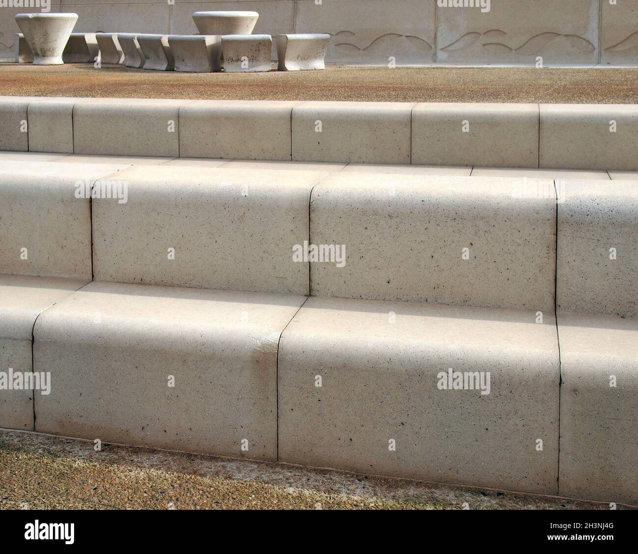 Modern angled outdoor steps with rounded corners in textured grey and ...