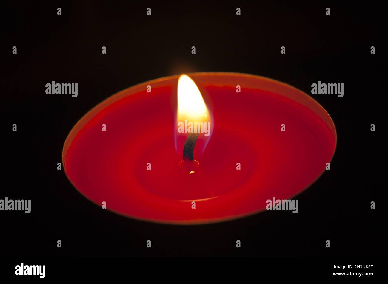 One red candle for Christmas Stock Photo - Alamy