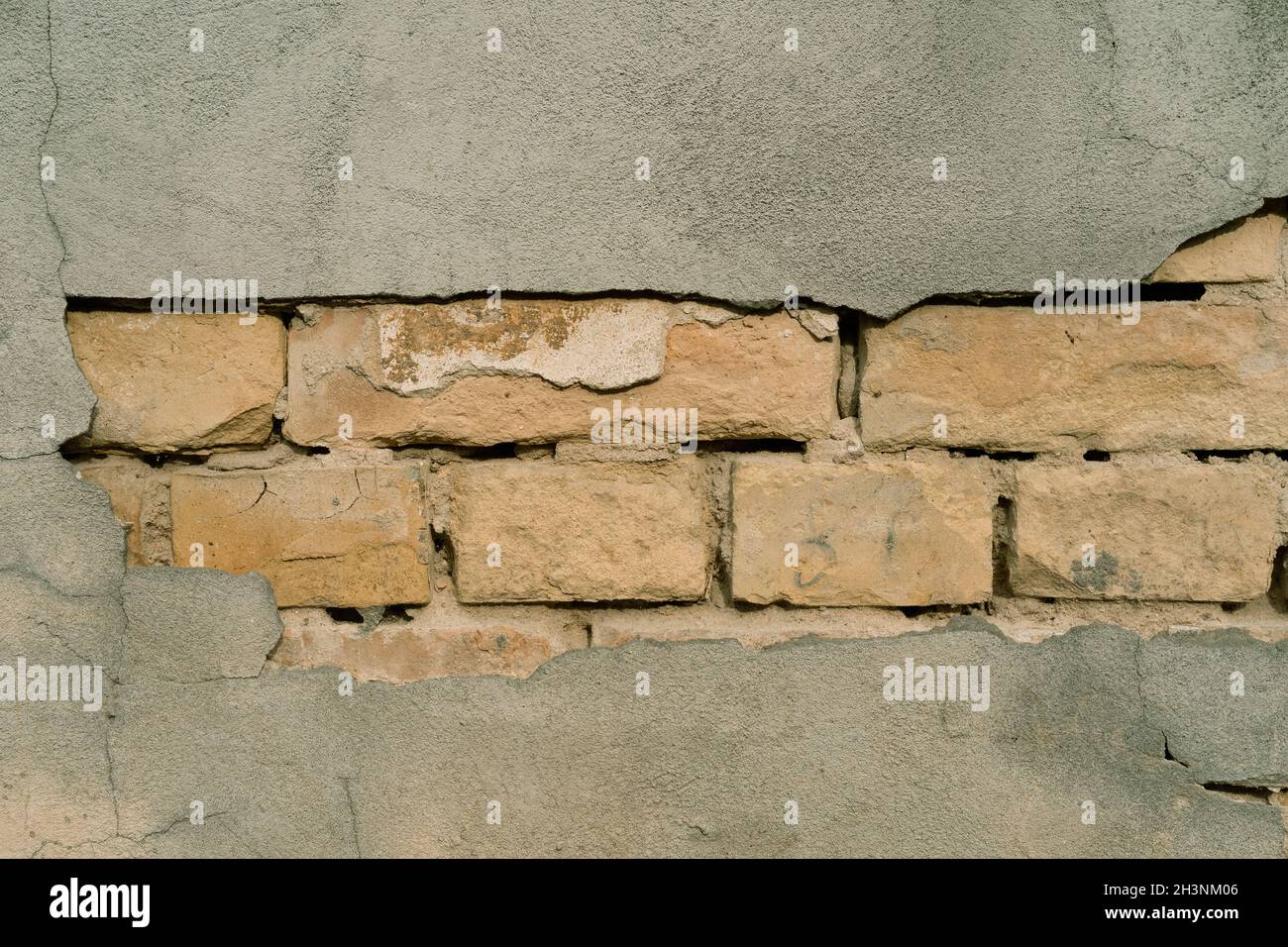 Texture of outer wall with fallen plaster. Old building with falling ...