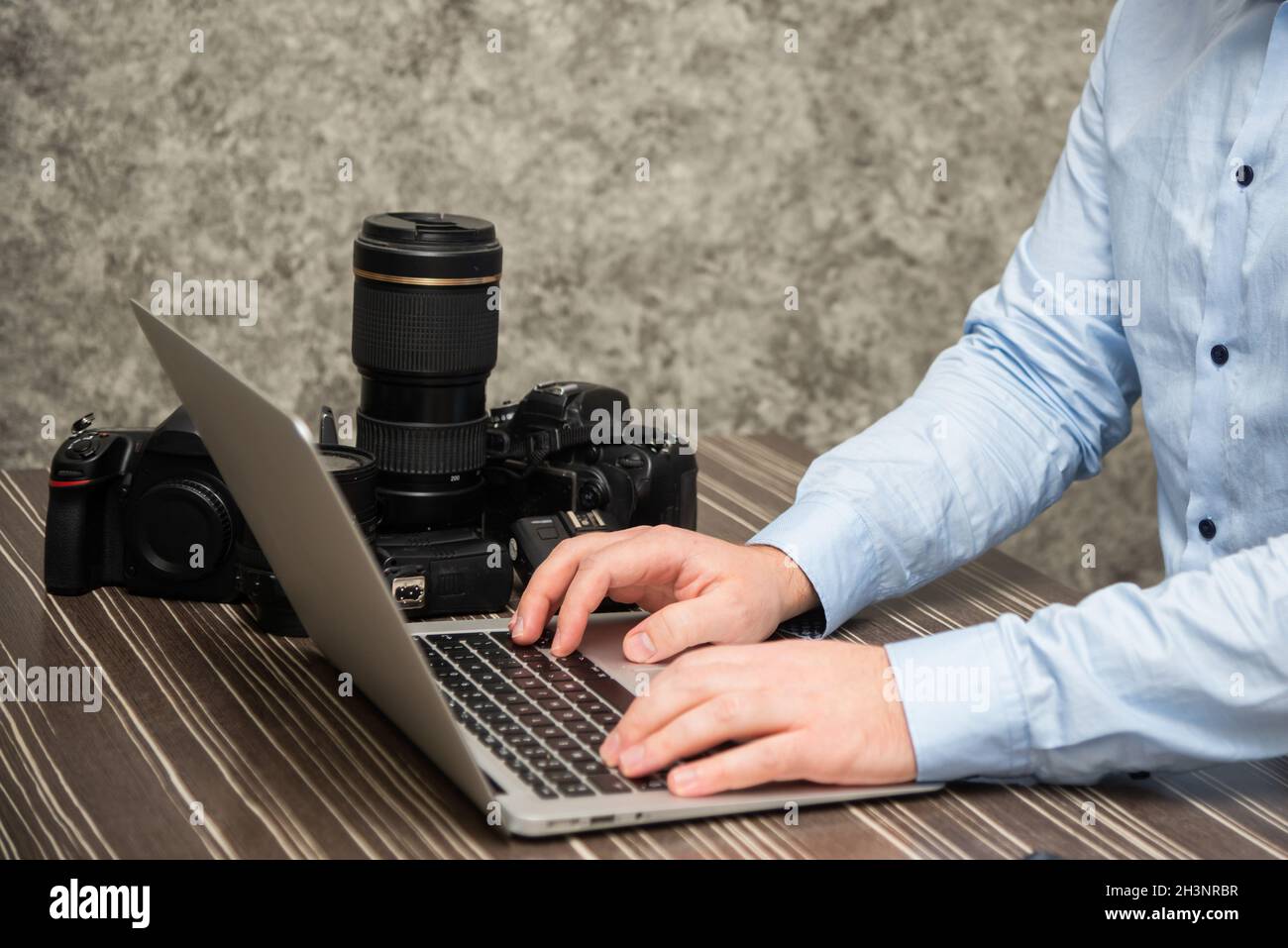 Desk photographer laptop cameras hi-res stock photography and images ...