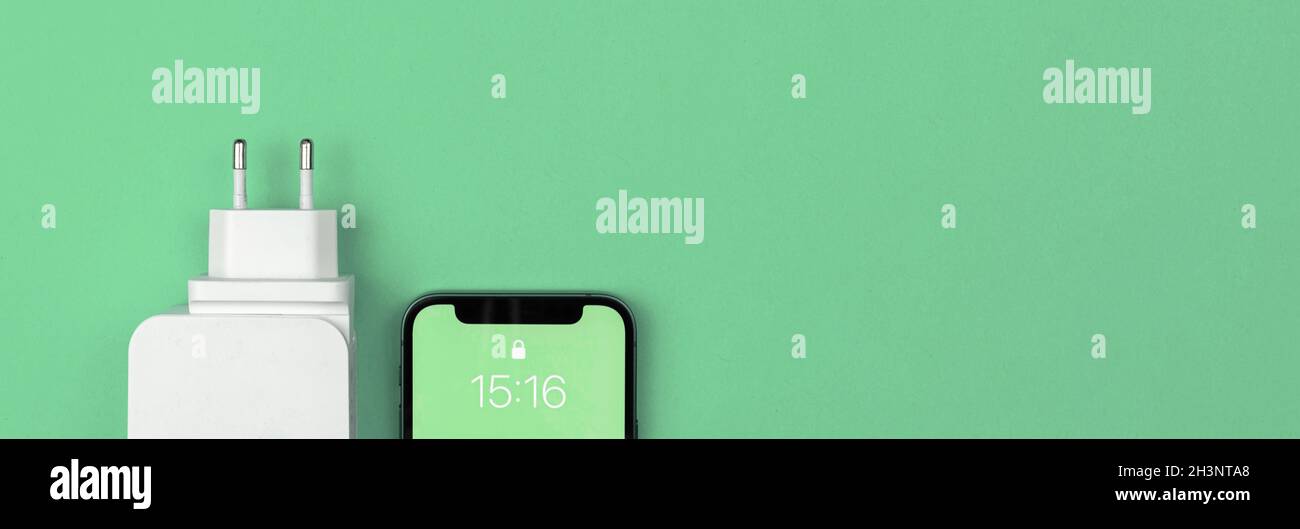 USB charger adapter for mobile phone. EU type. Banner, mint background ...