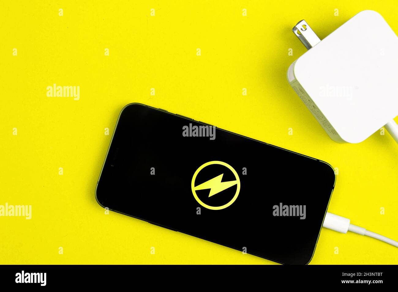 Smartphone charger adapter. Mobile phone with energy icon on the screen ...