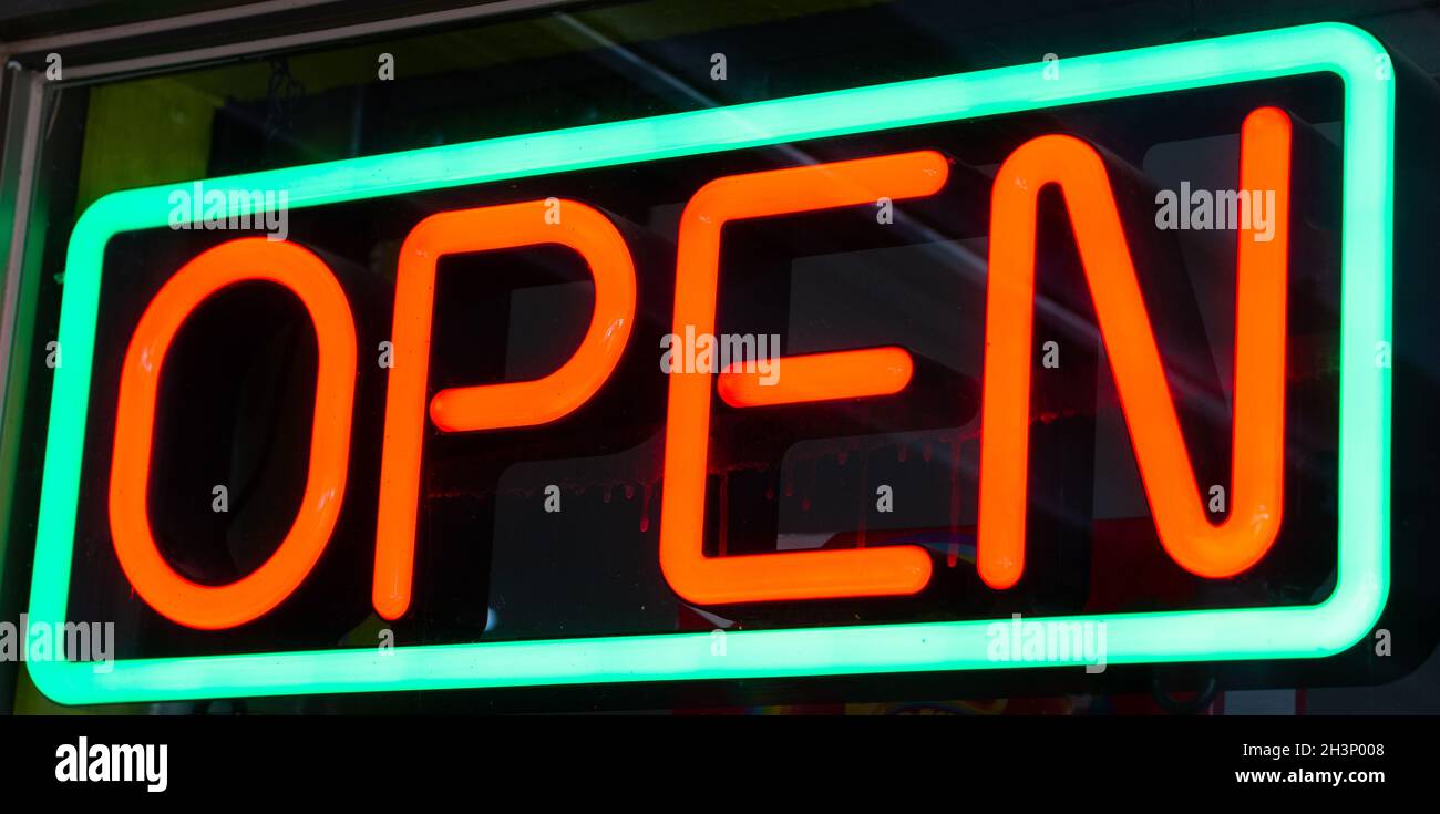Green and red neon open sign at night. Store, bar, business concepts ...