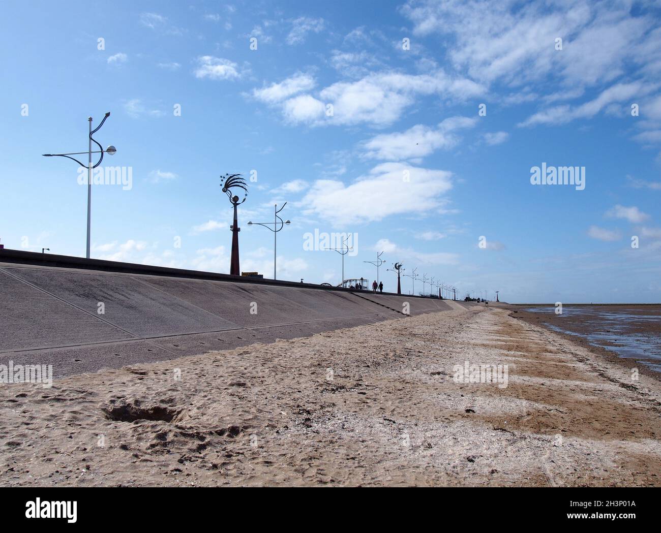 The seafront promenade in southport viewed from the beach with people ...