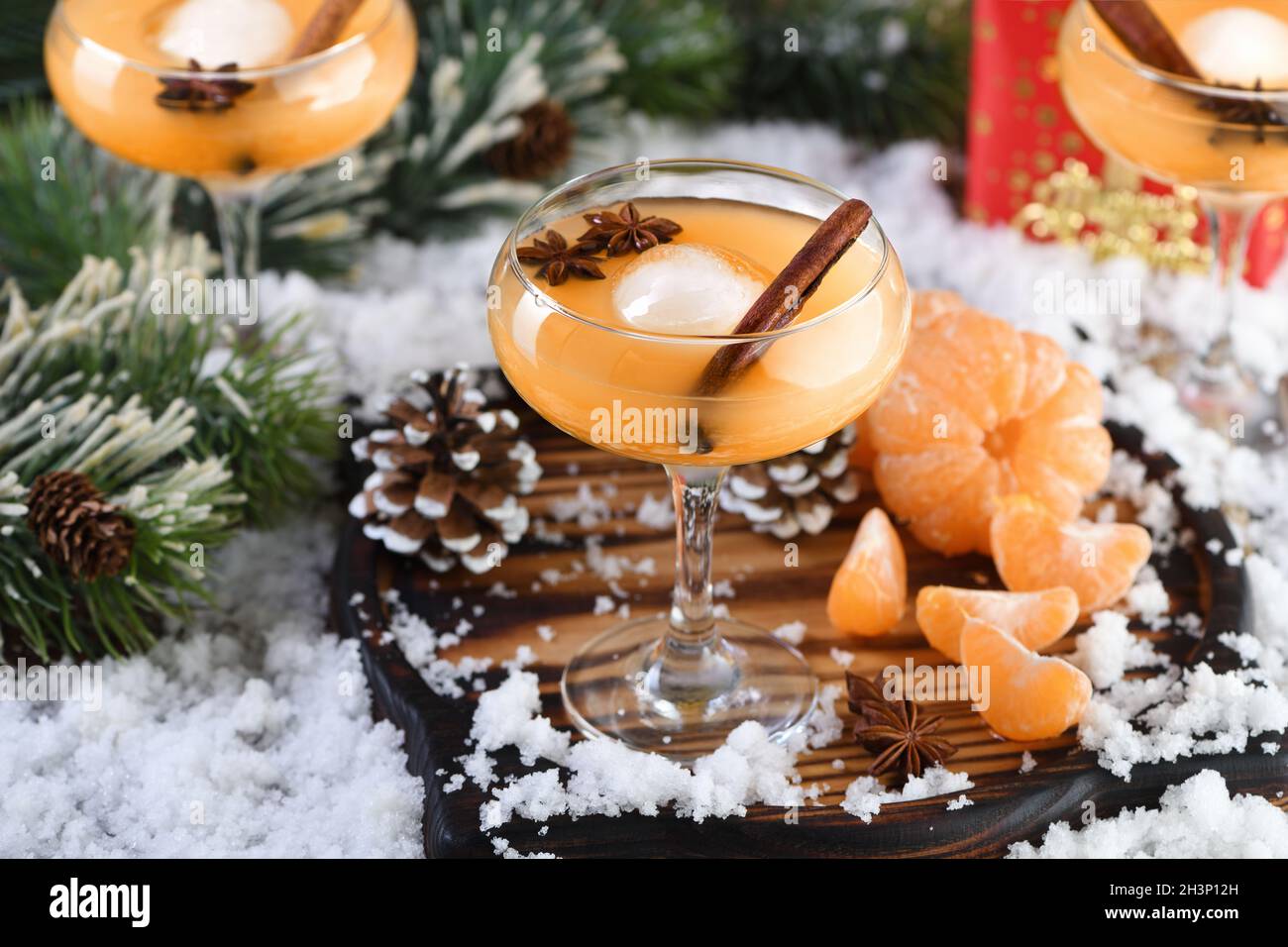 Negroni cocktail. Bourbon with cinnamon with mandarin juice and star ...