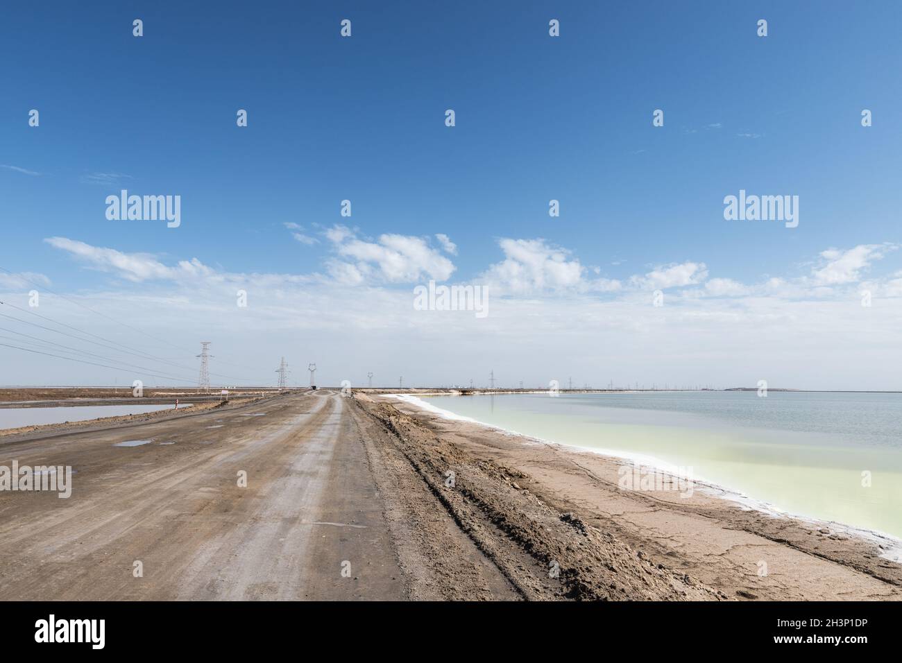 Simple dirt road on salt lake Stock Photo - Alamy