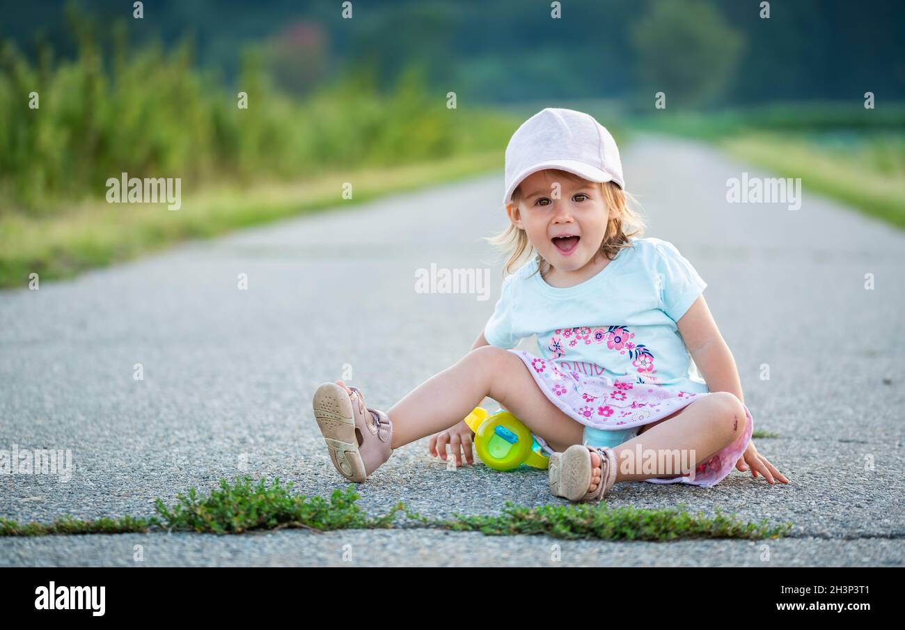 Girl Sitting On Asphalt Hi Res Stock Photography And Images Alamy