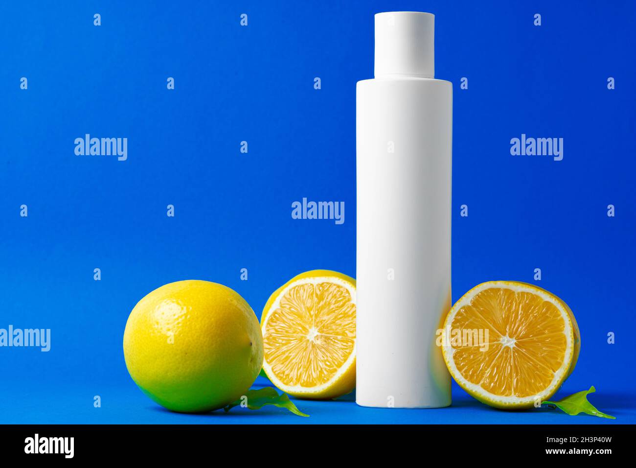 Bottle of skincare cosmetics with sliced lemons Stock Photo - Alamy