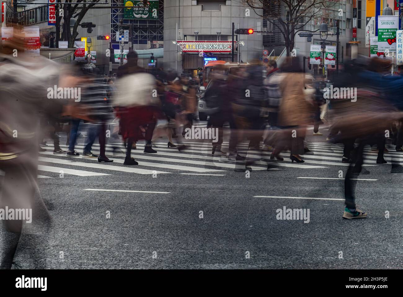 Hustle and bustle of Shibuya scramble intersection Stock Photo - Alamy