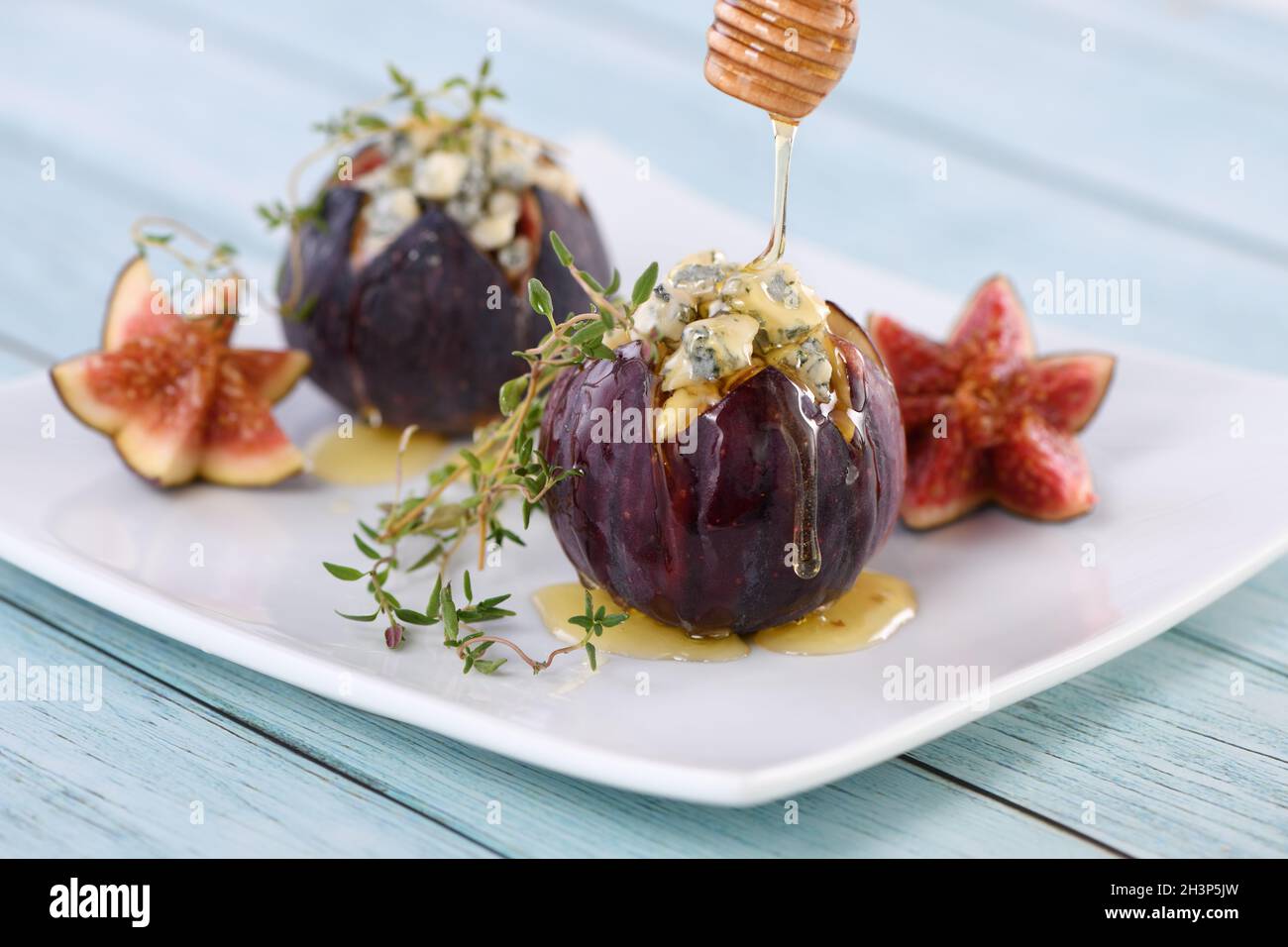 Figs stuffed with blue cheese Stock Photo - Alamy