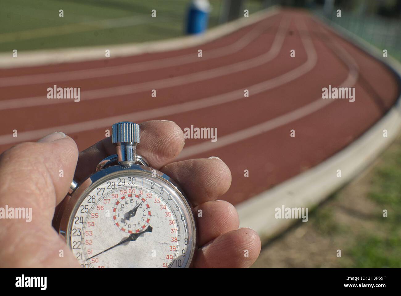 A stop watch and a running track Stock Photo - Alamy