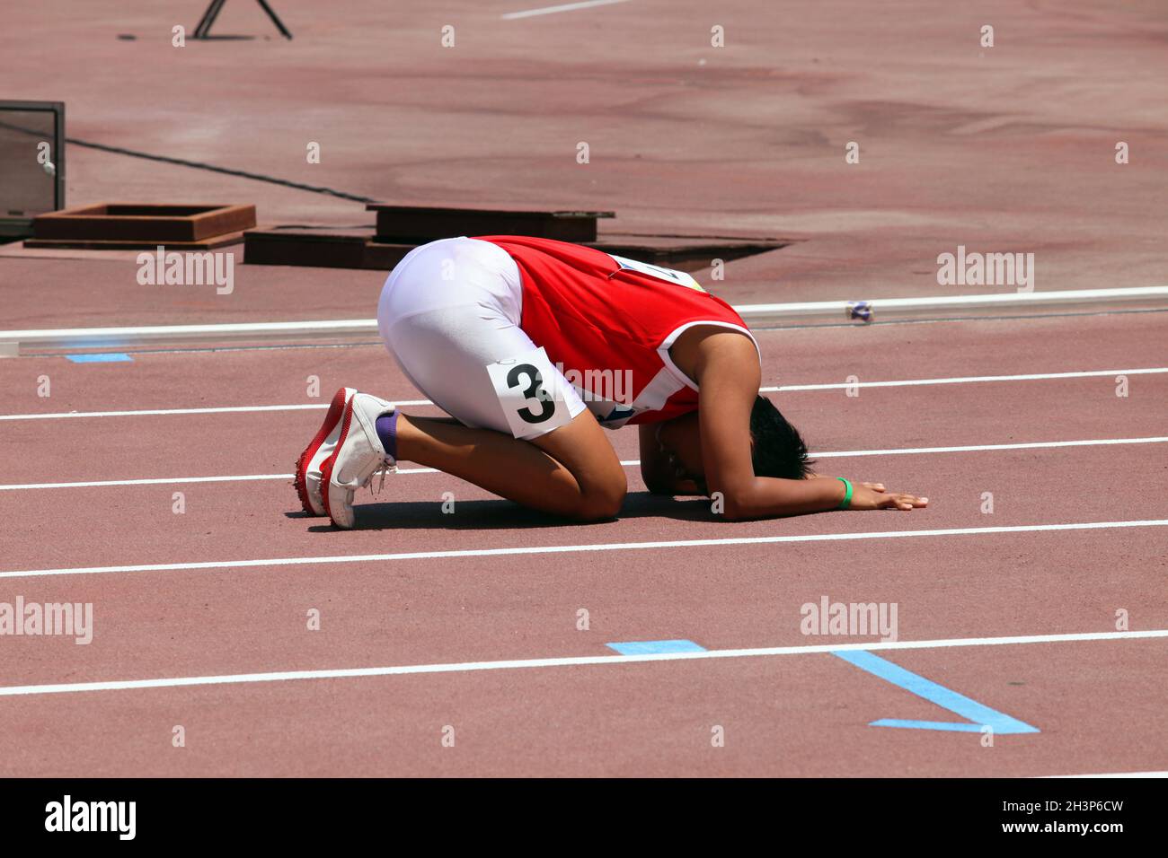 Sad athlete who lost his 100 meters run Stock Photo - Alamy