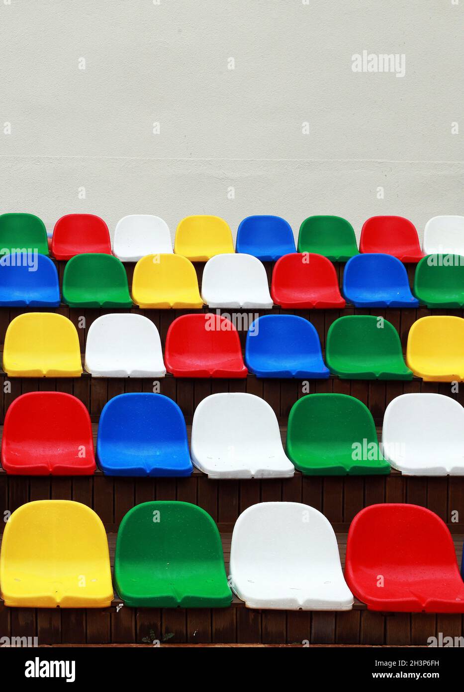 Colorful seats in the stadium Stock Photo - Alamy