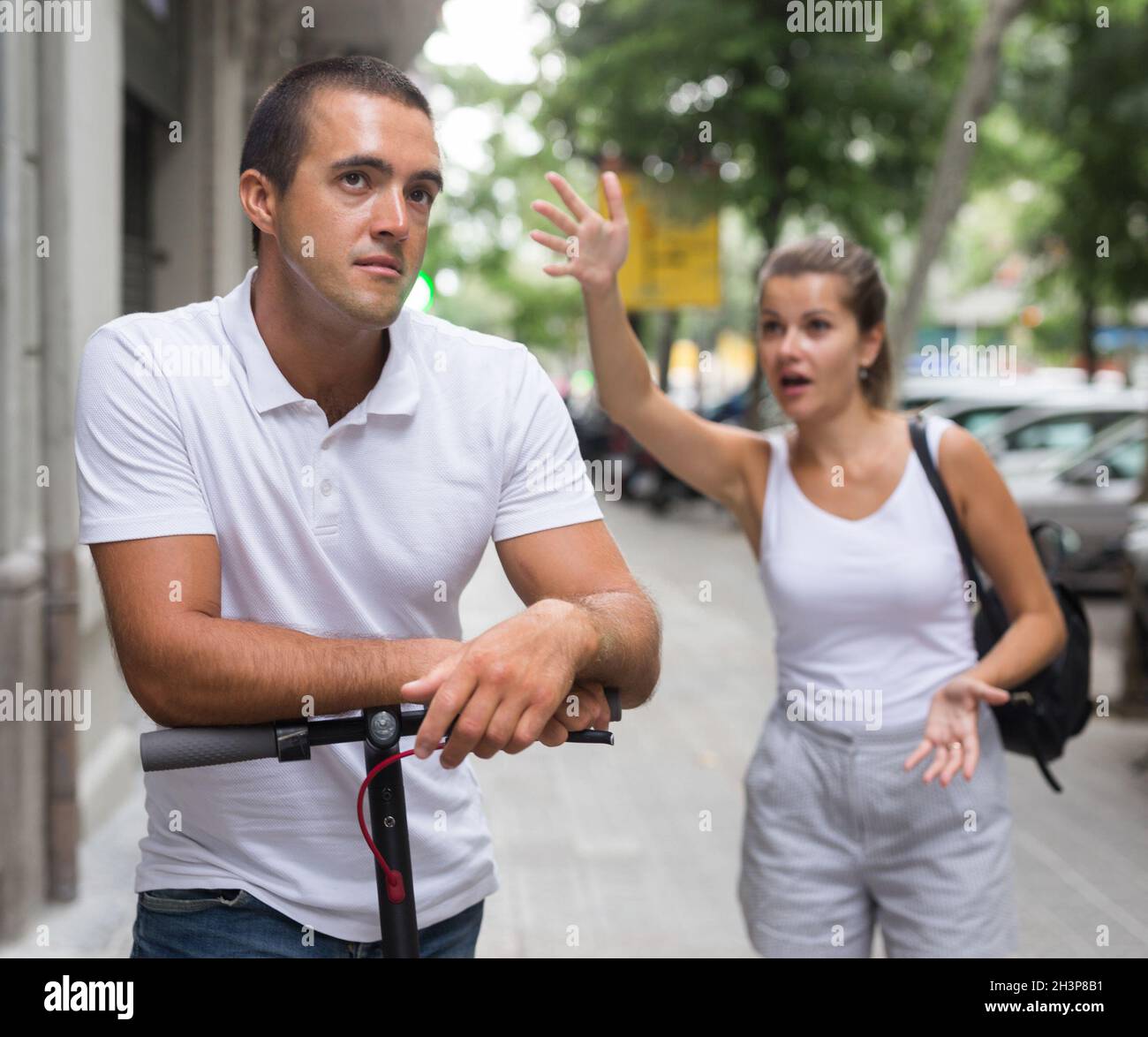 Girl scolding her boyfriend Stock Photo - Alamy