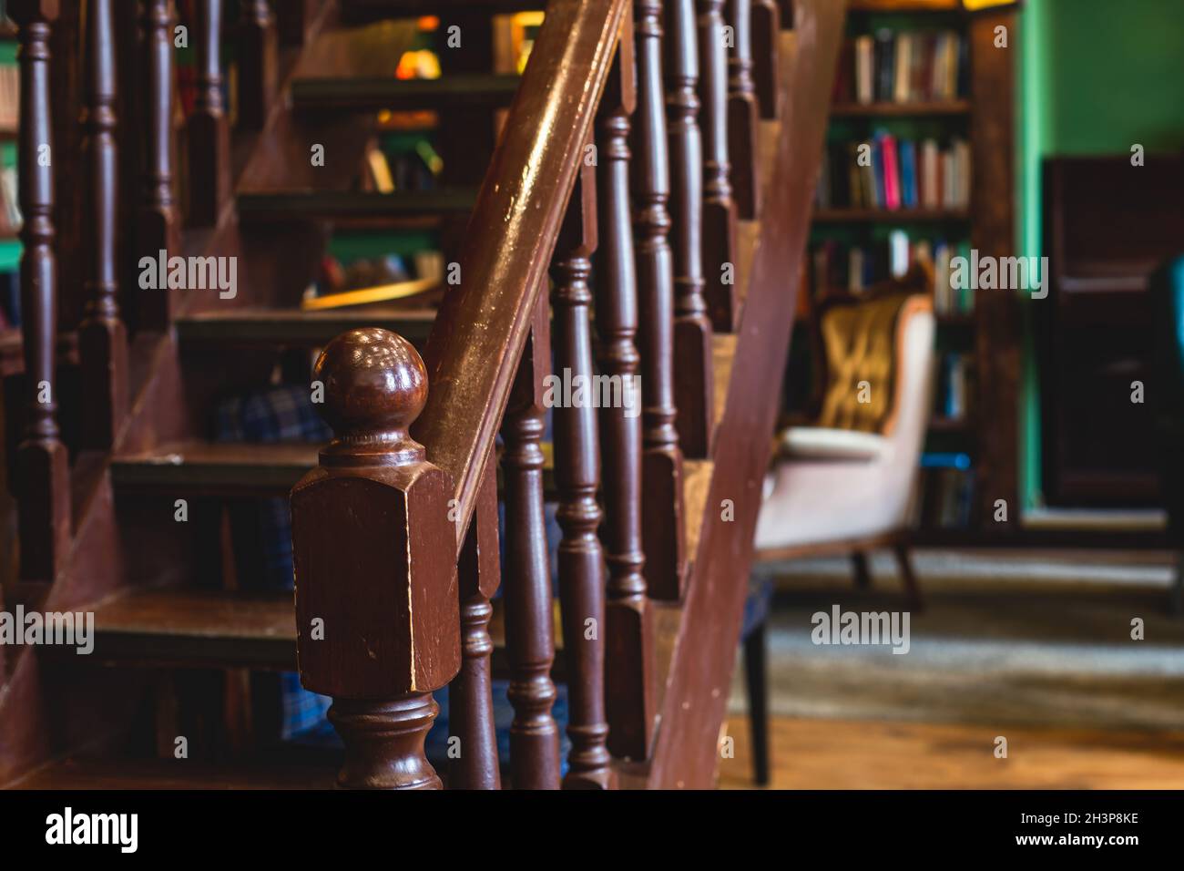 Old university college library interior with a bookshelves, books and ...