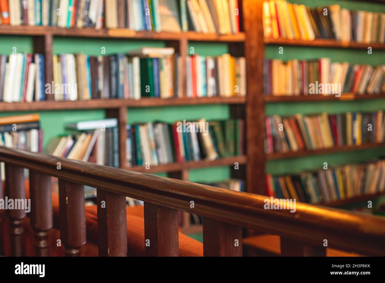 Old university college library interior with a bookshelves, books and ...