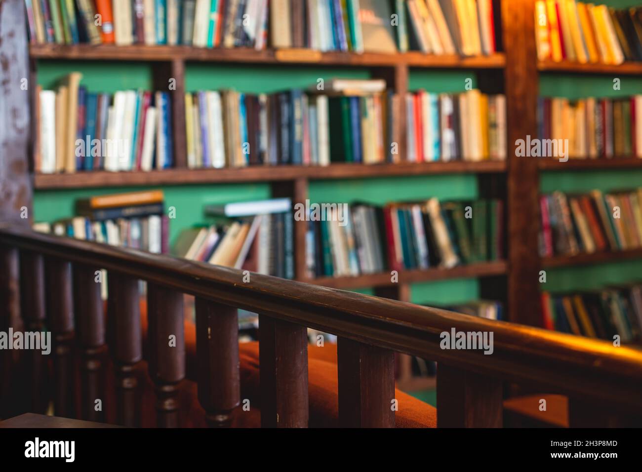 Old university college library interior with a bookshelves, books and ...