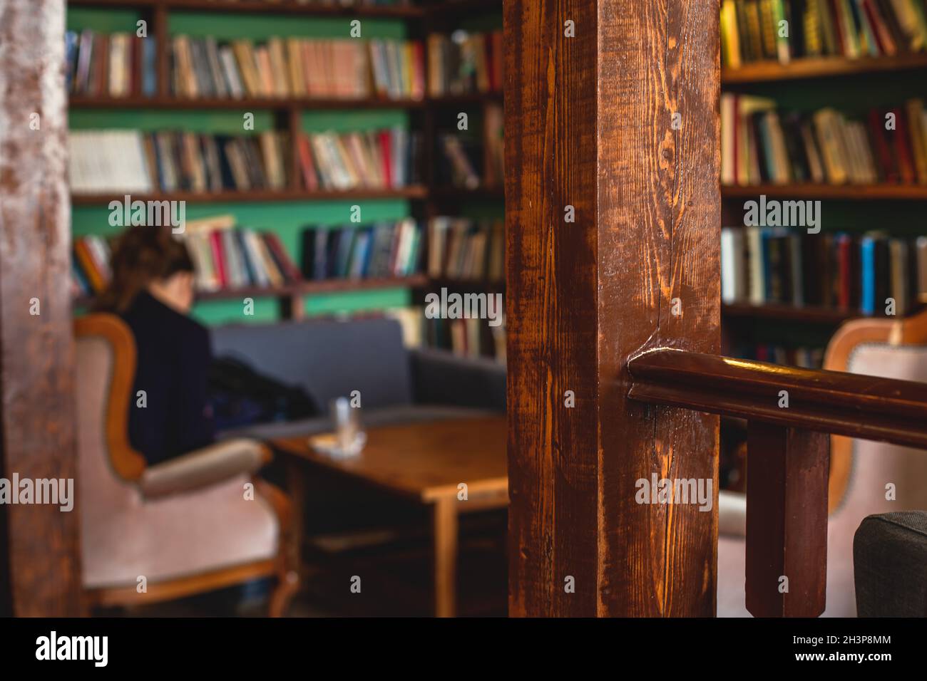 Old university college library interior with a bookshelves, books and ...