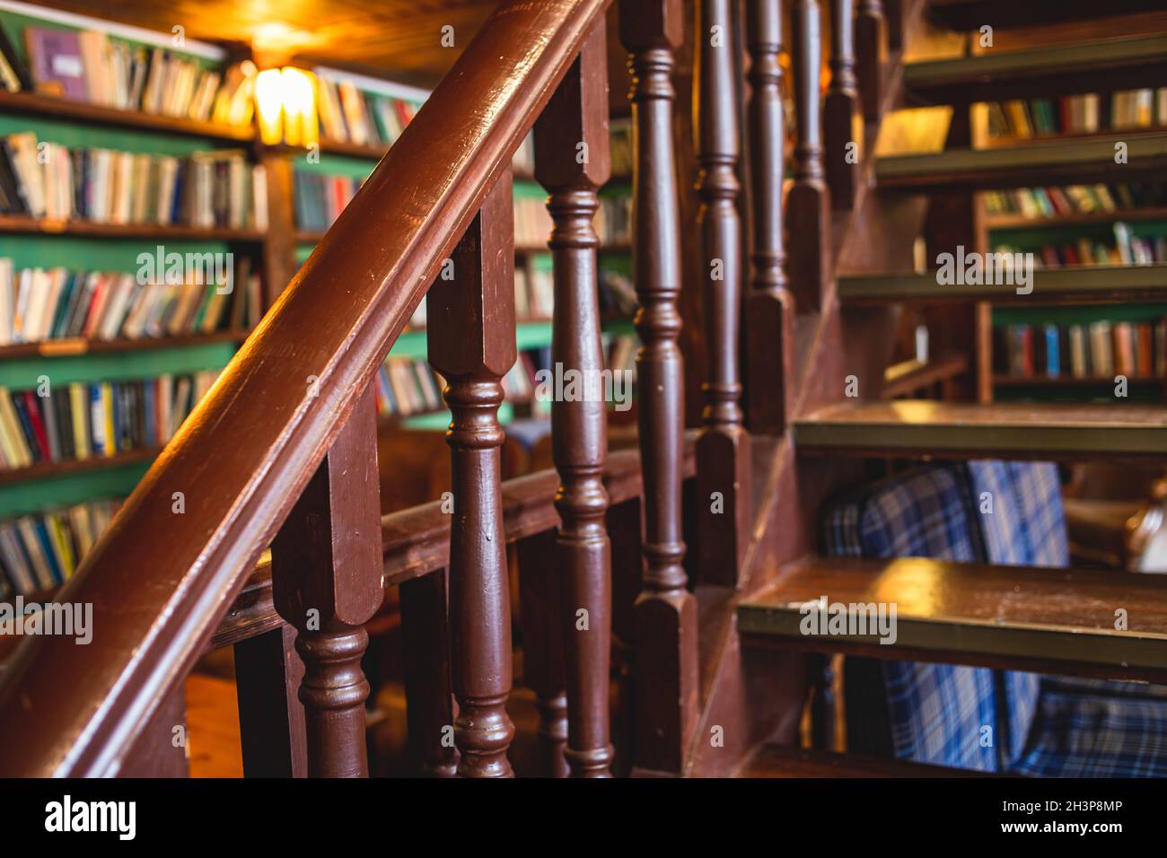Old university college library interior with a bookshelves, books and ...