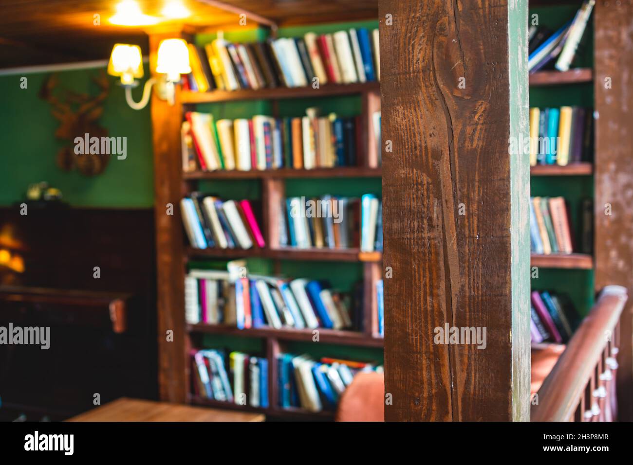 Old university college library interior with a bookshelves, books and ...