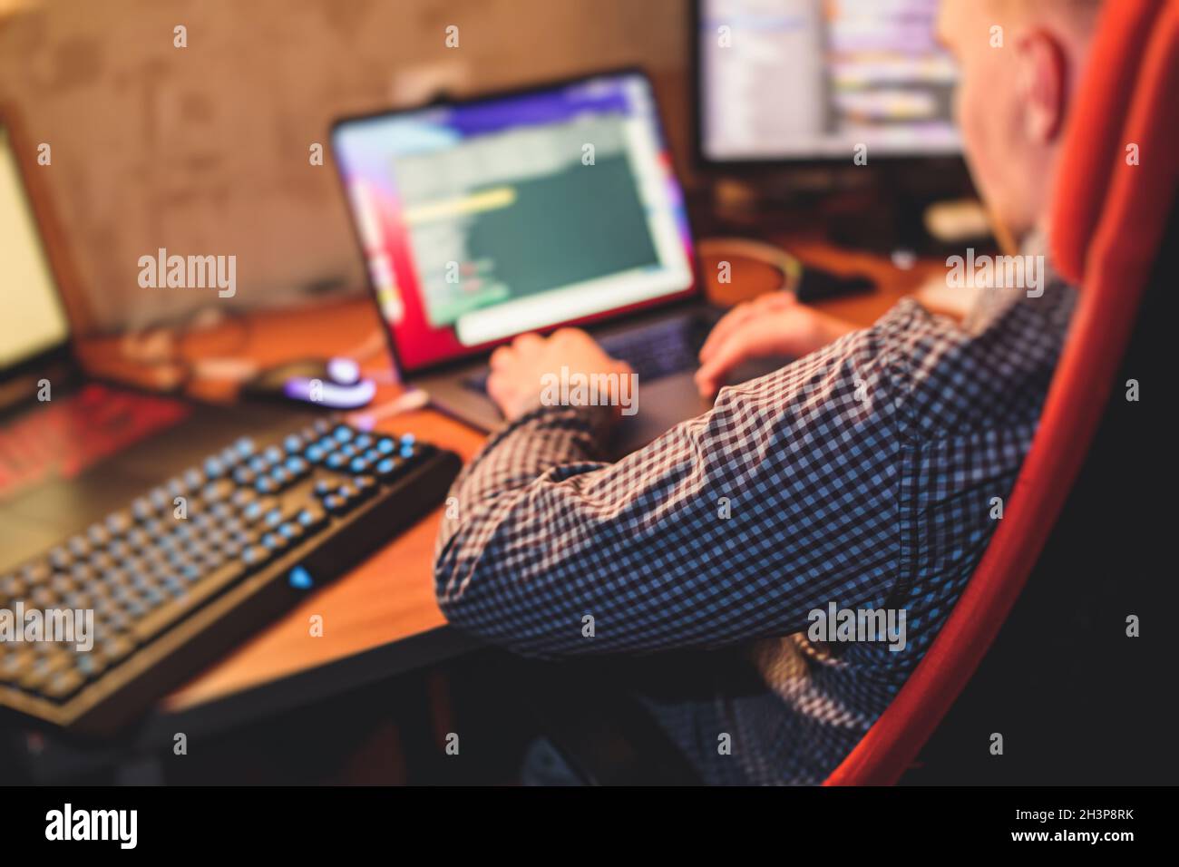 IT developer programmer working and coding on his worplace at home ...