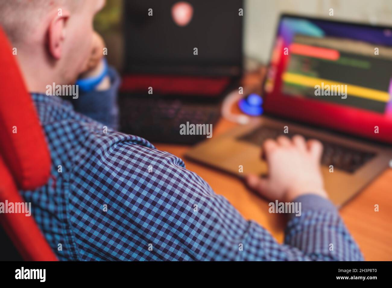 IT developer programmer working and coding on his worplace at home ...