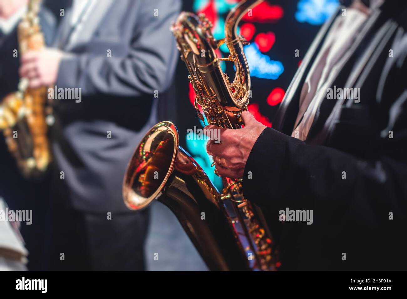 Concert view of a saxophonist, saxophone sax player with vocalist and ...
