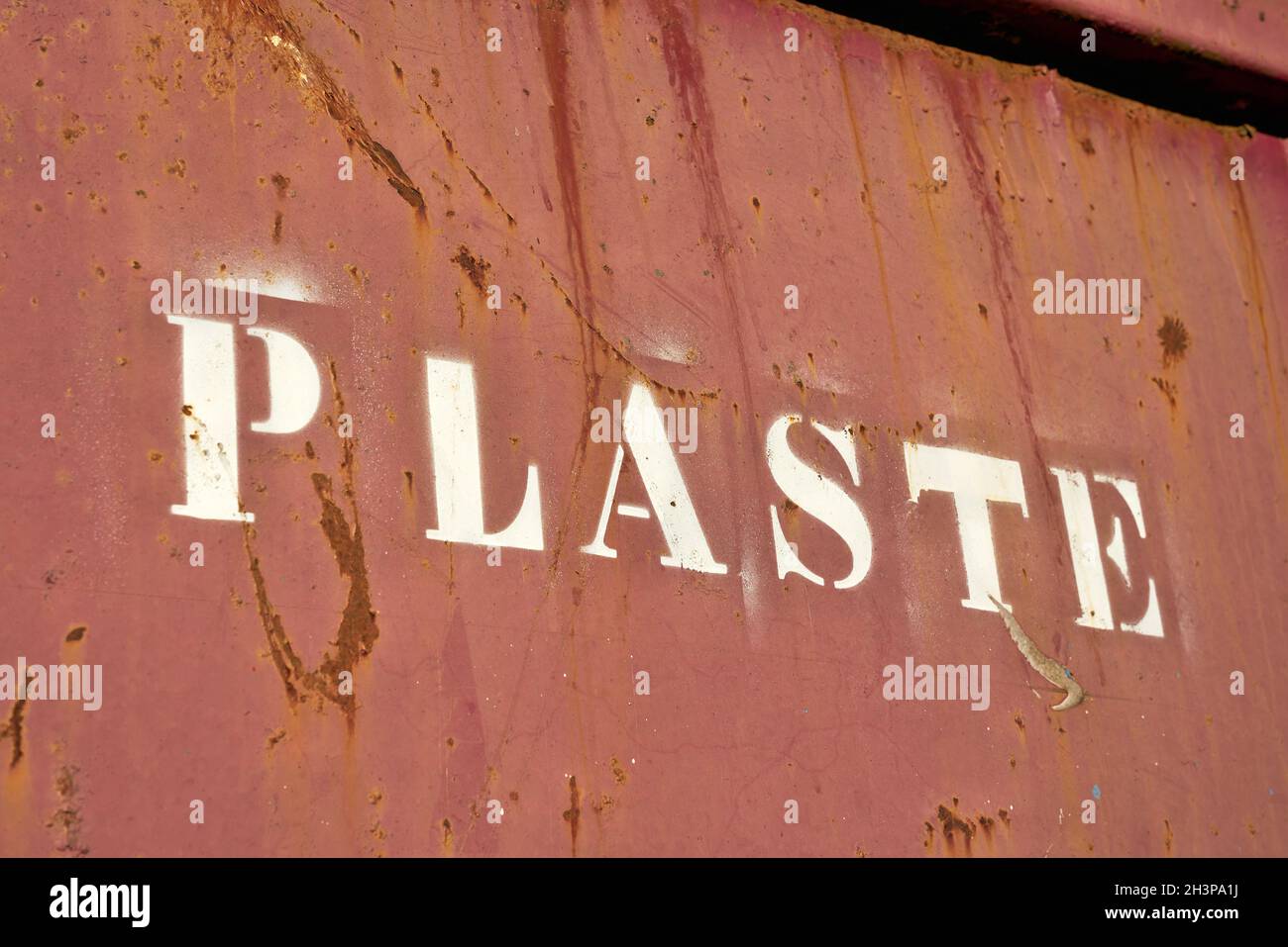 Lettering with the word Plaste (Plastic) on a container for collecting ...