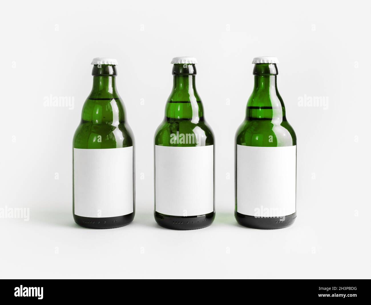 Three green bottles Stock Photo - Alamy