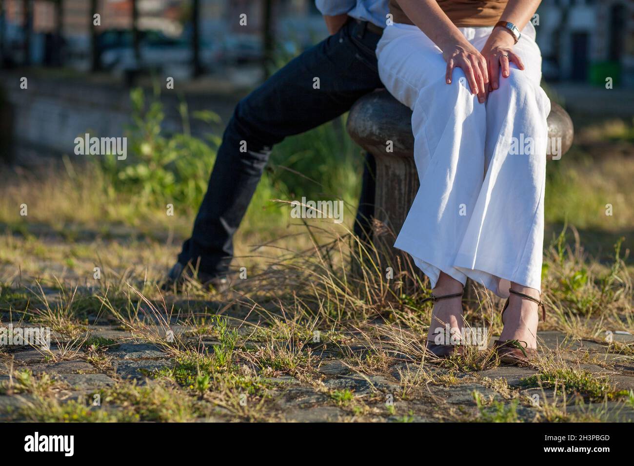 Couple hugging outdoor - close up on feet Stock Photo - Alamy