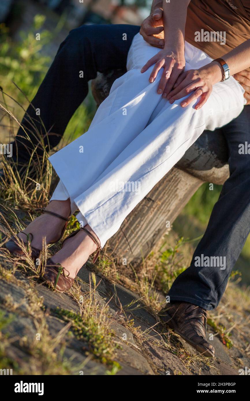 Couple hugging outdoor - close up on feet Stock Photo - Alamy