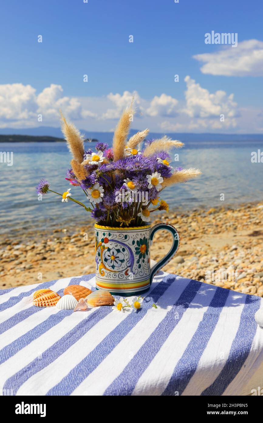 Bouquets of flowers in the beach Stock Photo - Alamy